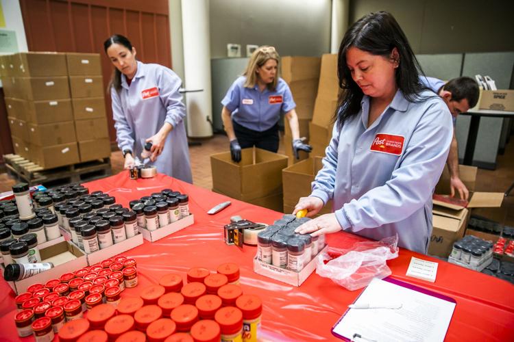 Local volunteers assemble meal kits at Northfield's Post plant | News ...