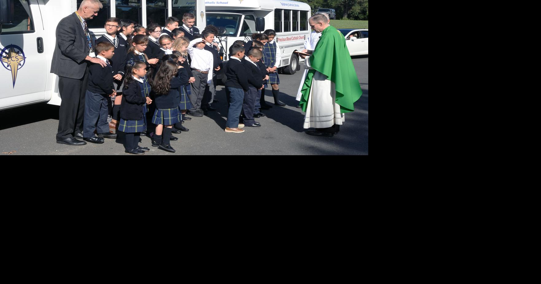 Buses, newly blessed, carry Catholic students to school
