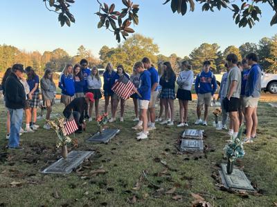 DAR, Starkville Academy plant flags at Memorial Gardens | News ...