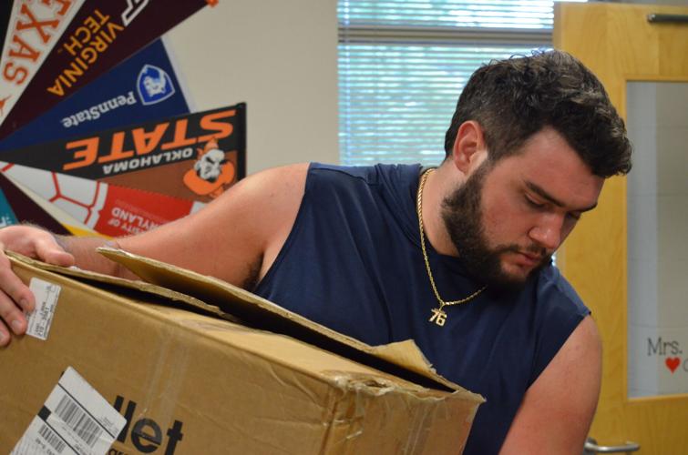 Brock Hoffman donates 50 book bags to Celeste Henkel Elementary School