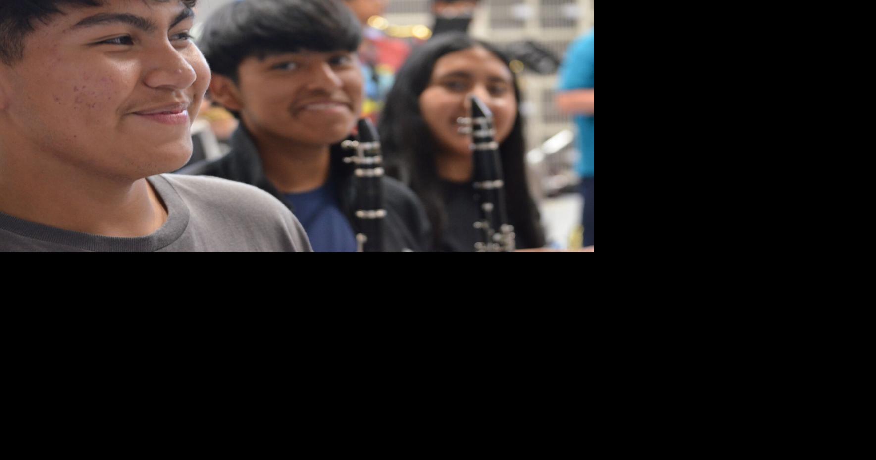 Joshua Almeida laughs with bandmates before practice for the South ...