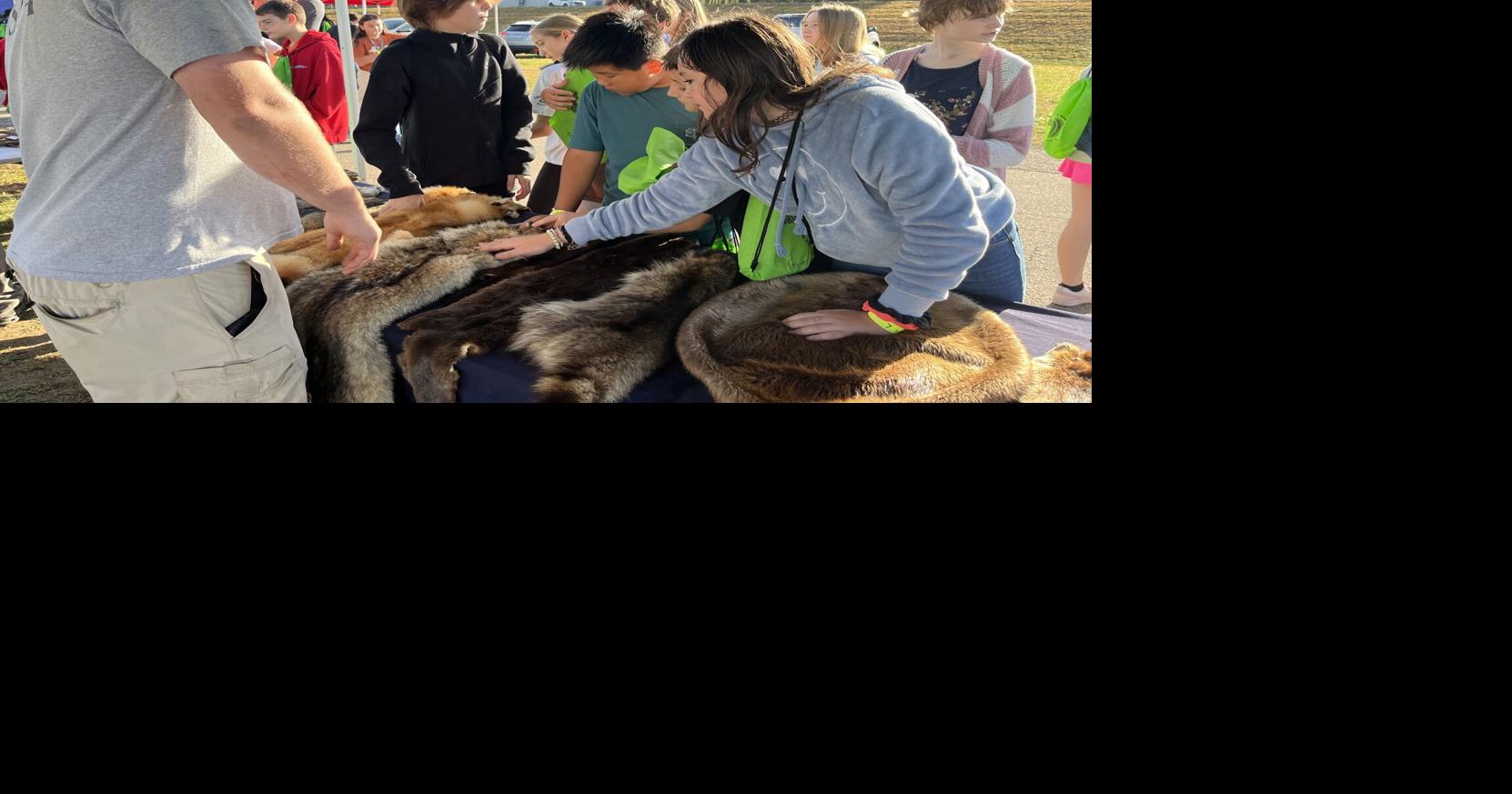 Landon Hedrick shows students furs and talks about different animals at ...