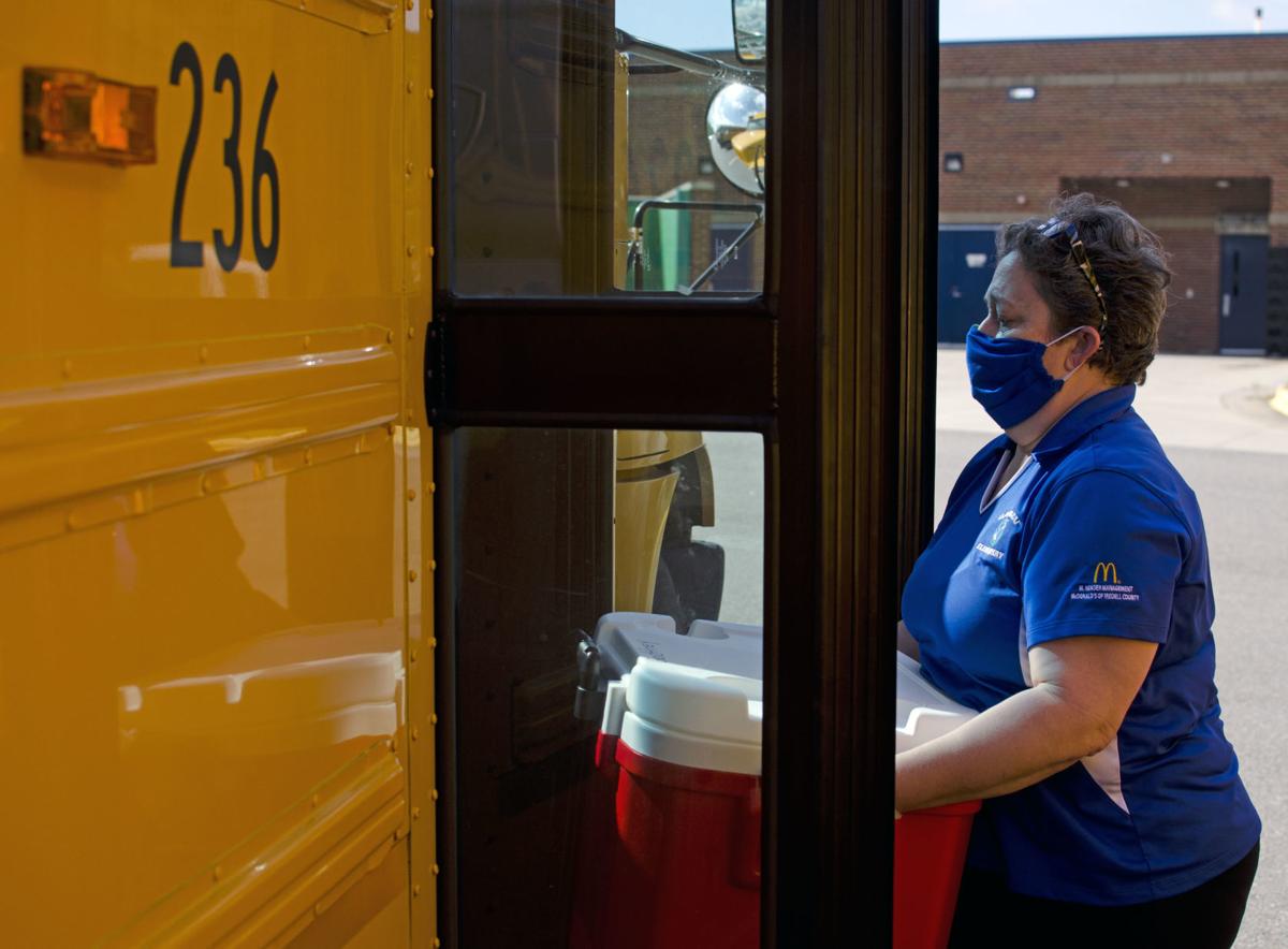 HELPING HANDS: Local bus drivers stay in touch with community, deliver ...
