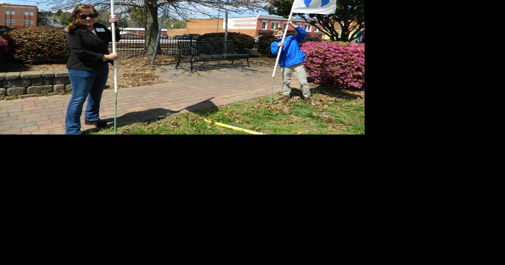 Flags and pinwheel gardens placed to bring awareness