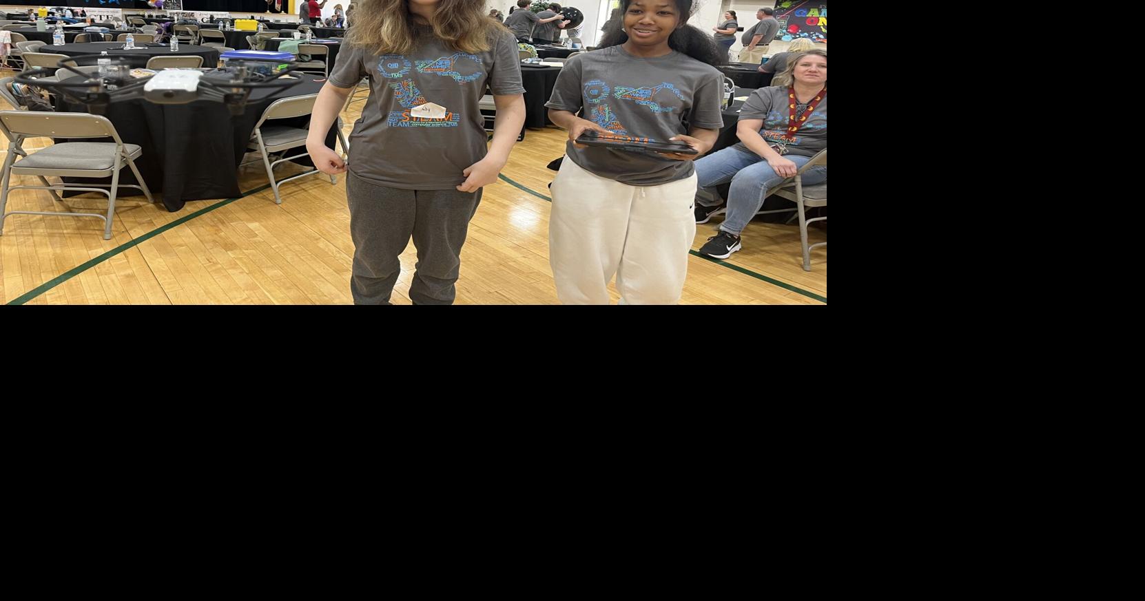 Ruby Corcoran watches as Sydney Copeland flies a drone during a STEAM ...