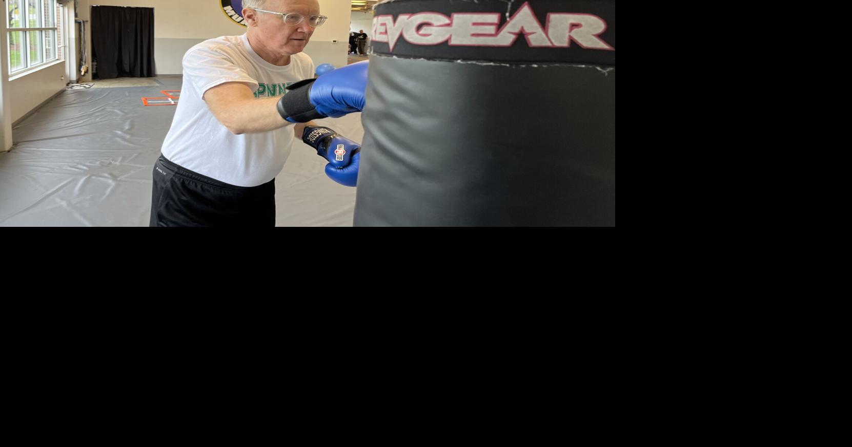 John Raley works a heavy bag at Lake Norman Muay Thai in Mooresville on ...