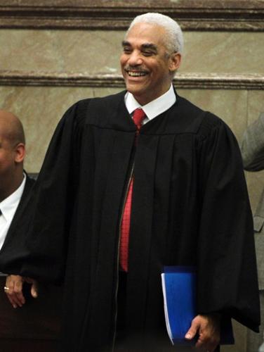 Judge George W. Draper, III, laughs while listening to his daughter