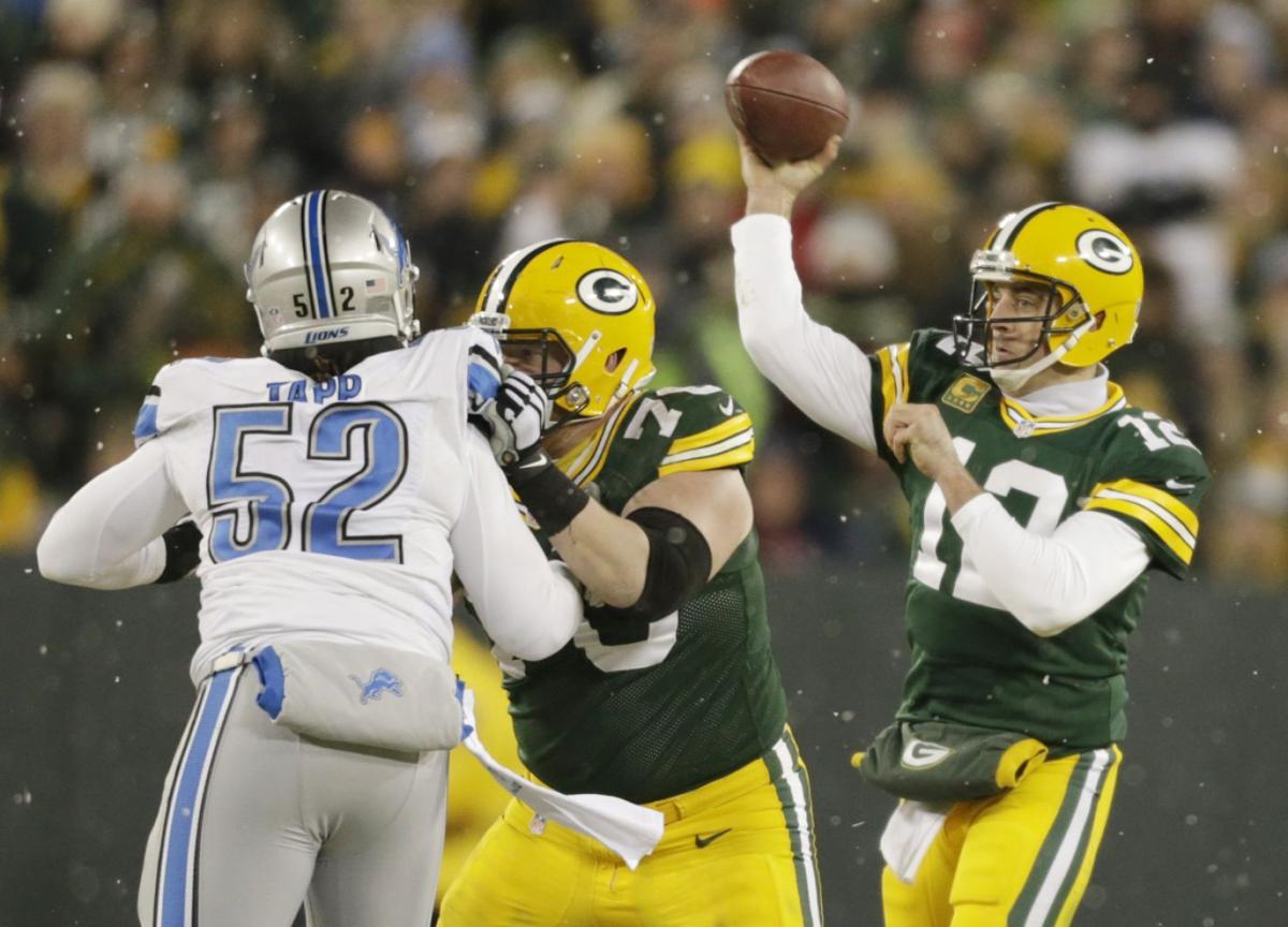 Rodgers returns, energizes Packers to NFC North title