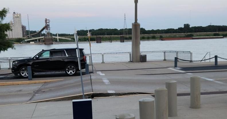Pavement buckles amid heat on street by St. Louis' Arch