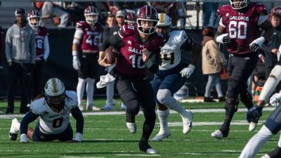 SIU grad assistant suits up to fill QB void, sets school record with 7 ...