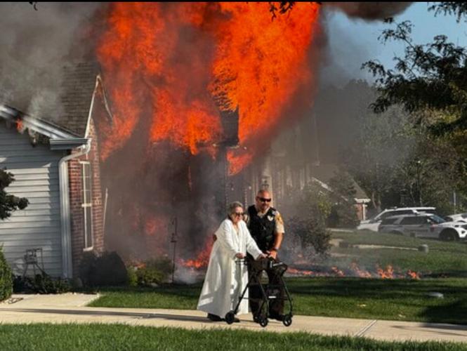 Passerby pulls residents from Wildwood house fire