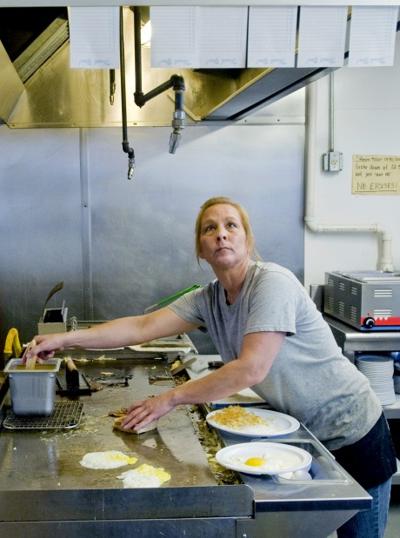 Short-order cook keeps pace with tide of orders