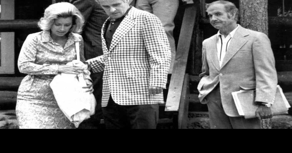 Thomas Eagleton helps wife down stairs as McGovern looks on