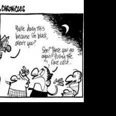 Artist says protesters missed the point of "race card" cartoon