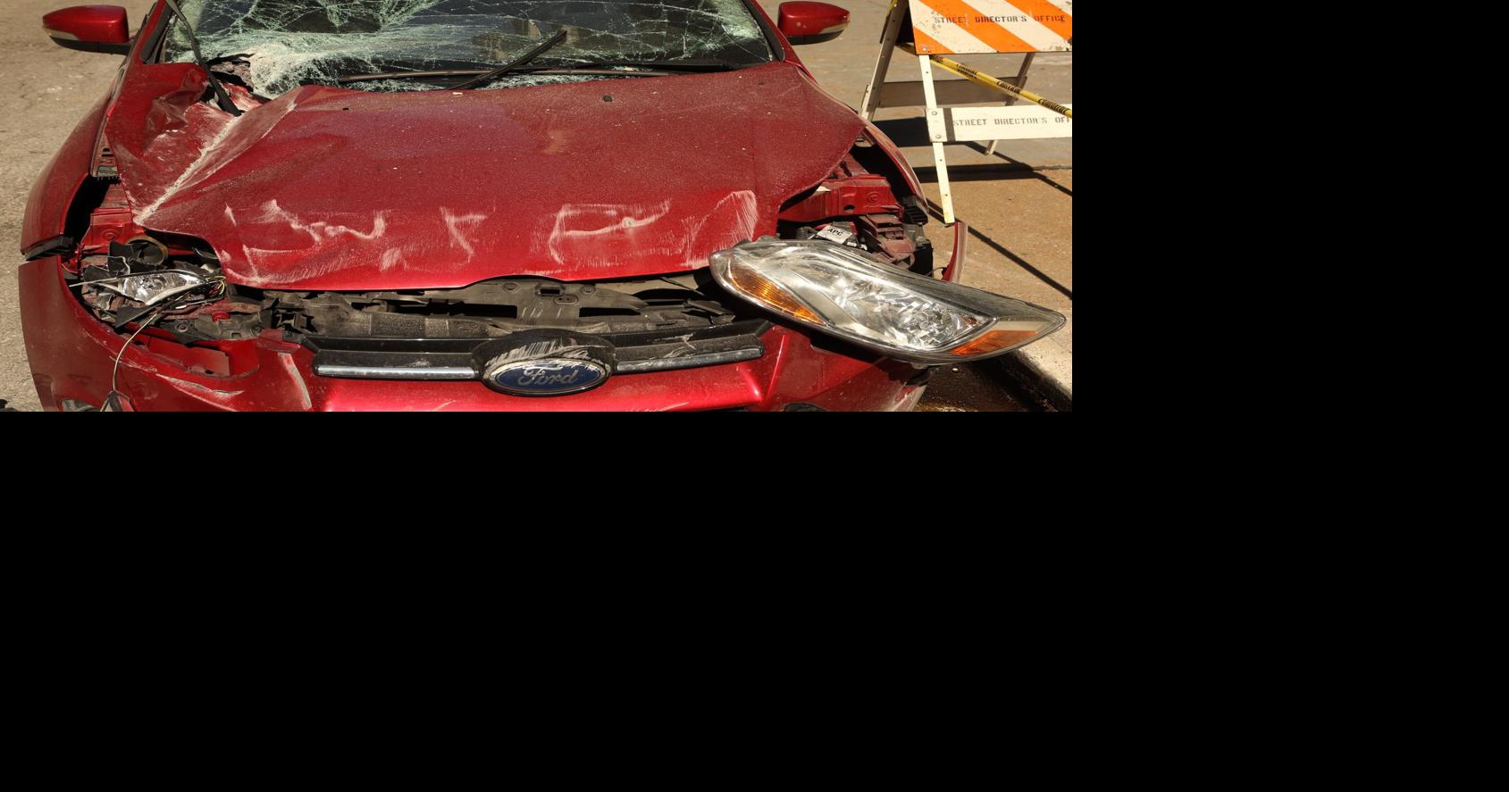 Falling chunk of concrete crushes car parked in downtown St. Louis