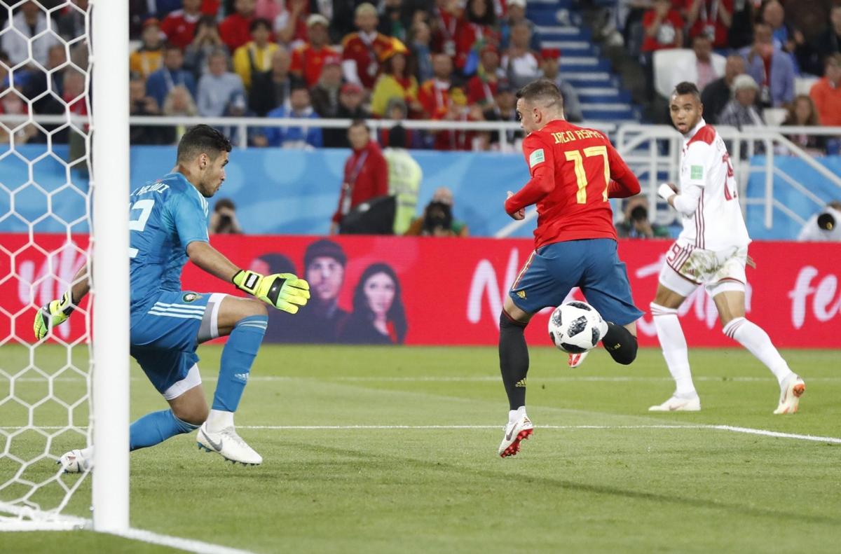 Late-match goal lifts Spain to group title
