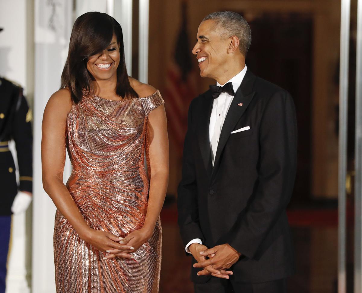 Michelle Obama shines in Versace at White House dinner