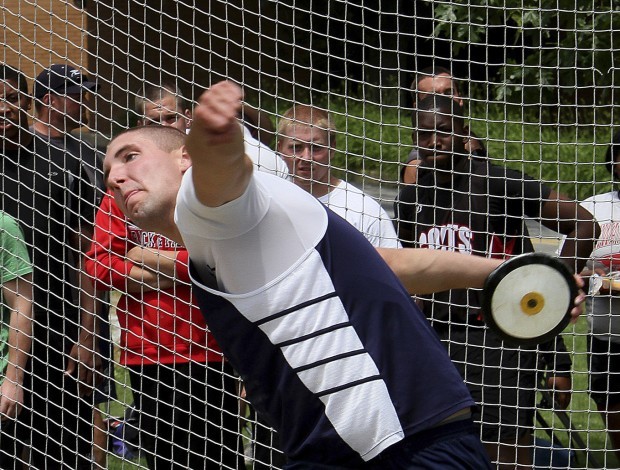 McDonald throws competition for a loop in discus, shot