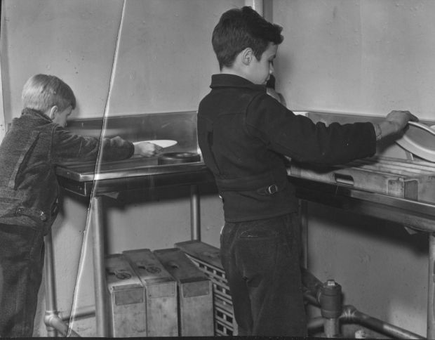 A Look Back • Rev. Dunne, former orphan, establishes Newsboys Home in 1906