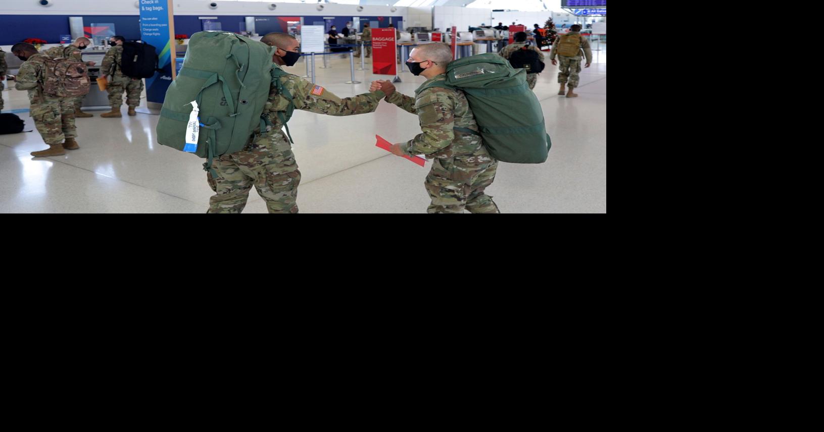 Soldiers take off on holiday leave from a quiet Lambert