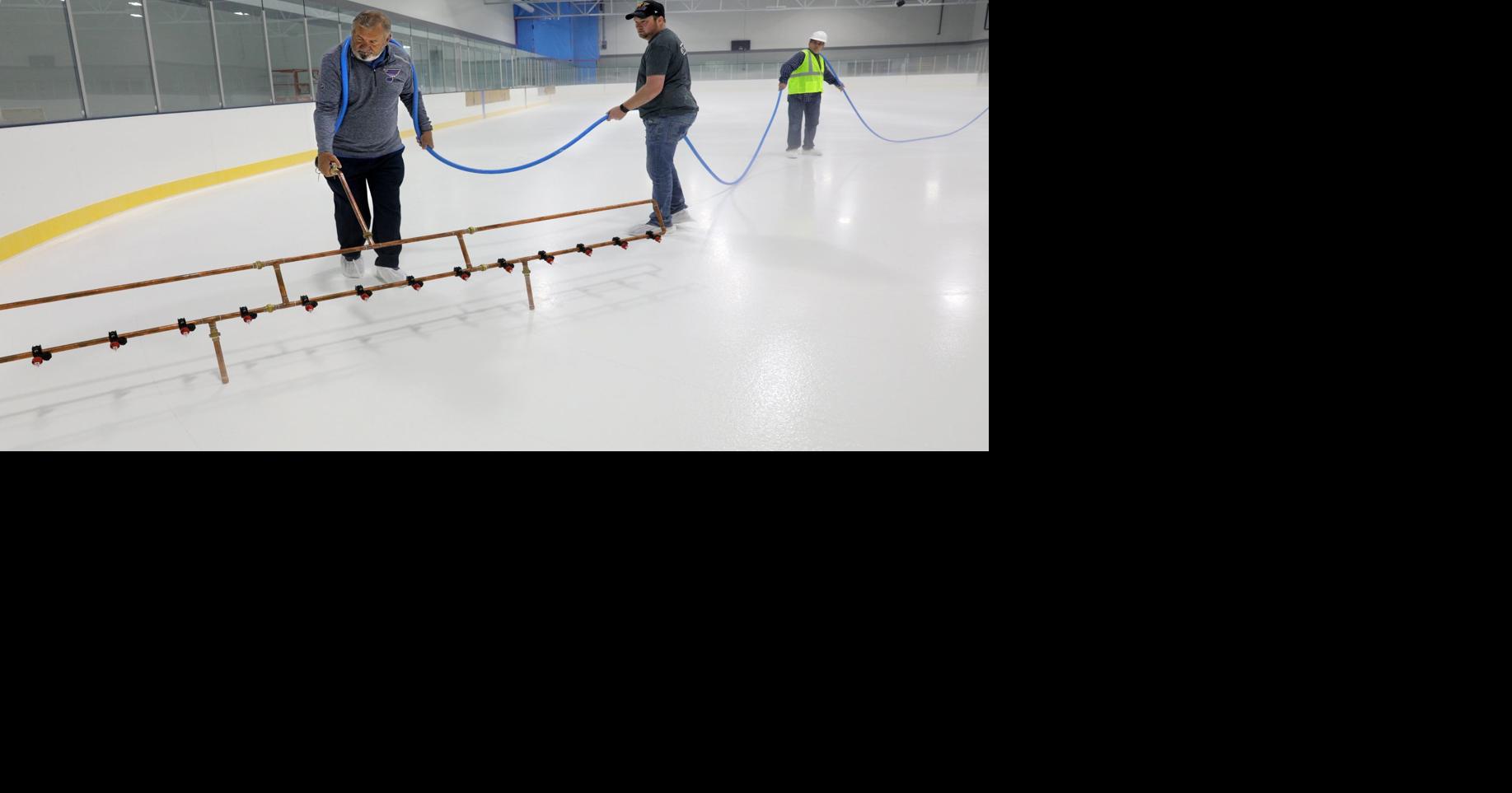 Photos: Plager helps lay ice on rink at the Centene Community Ice Center