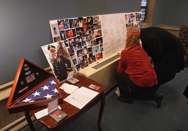 Mass honors man slain in Iraq