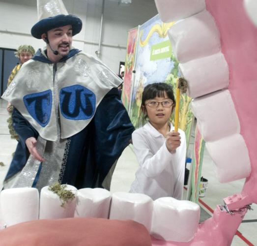 Tooth Wizard fights PlaqueMan in the 'Land of Smiles'