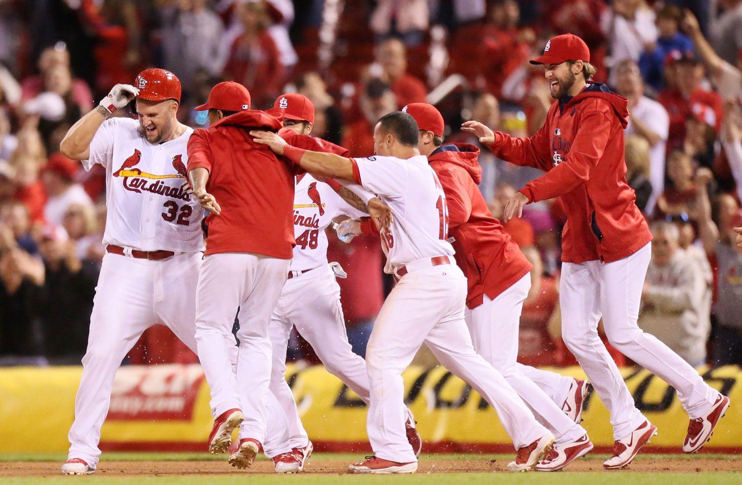 Cards win on Adams' single in 10th