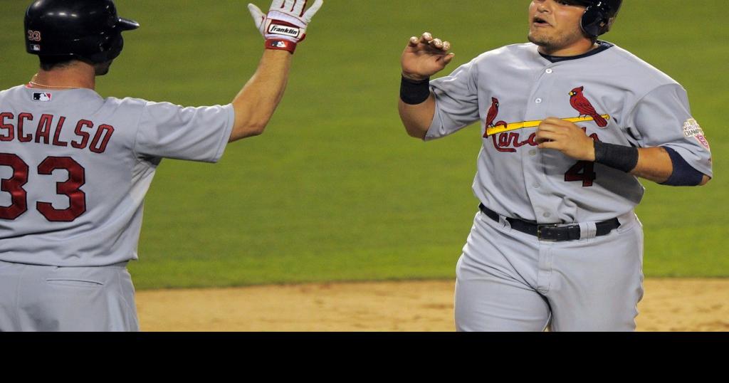 Cardinals edge Dodgers in opener