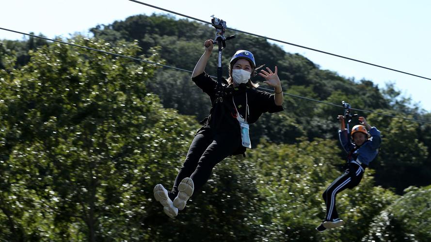 At Japan theme park, guests zipline into Godzilla's mouth