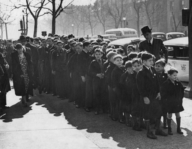 A Look Back • Rev. Dunne, former orphan, establishes Newsboys Home in 1906