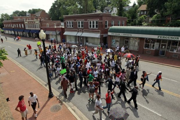Hundreds of protesters march to Ferguson police department