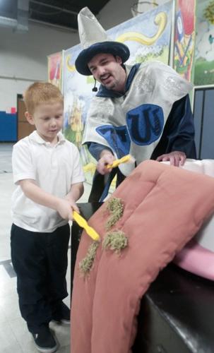 Tooth Wizard fights PlaqueMan in the 'Land of Smiles'