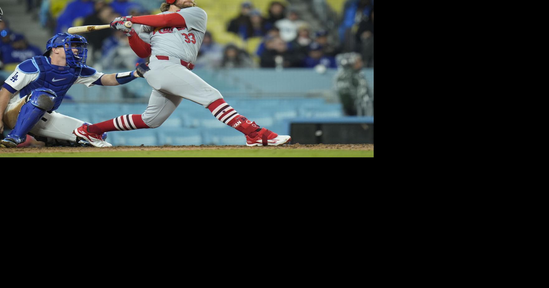 Cardinals wade through puddles, down Dodgers in extras