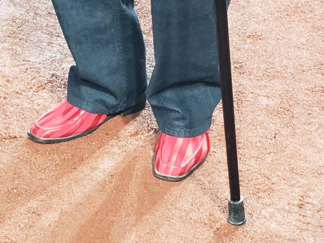 In Cardinal red kicks, Charles Glenn kicks off NLCS