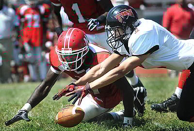 FOOTBALL: Triad passes way to big win on the road