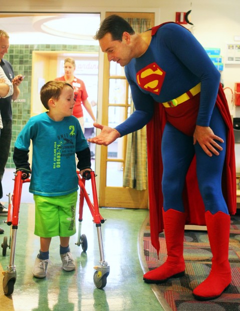 Superman fan shares his bounty with kids at St. Louis hospital | St ...