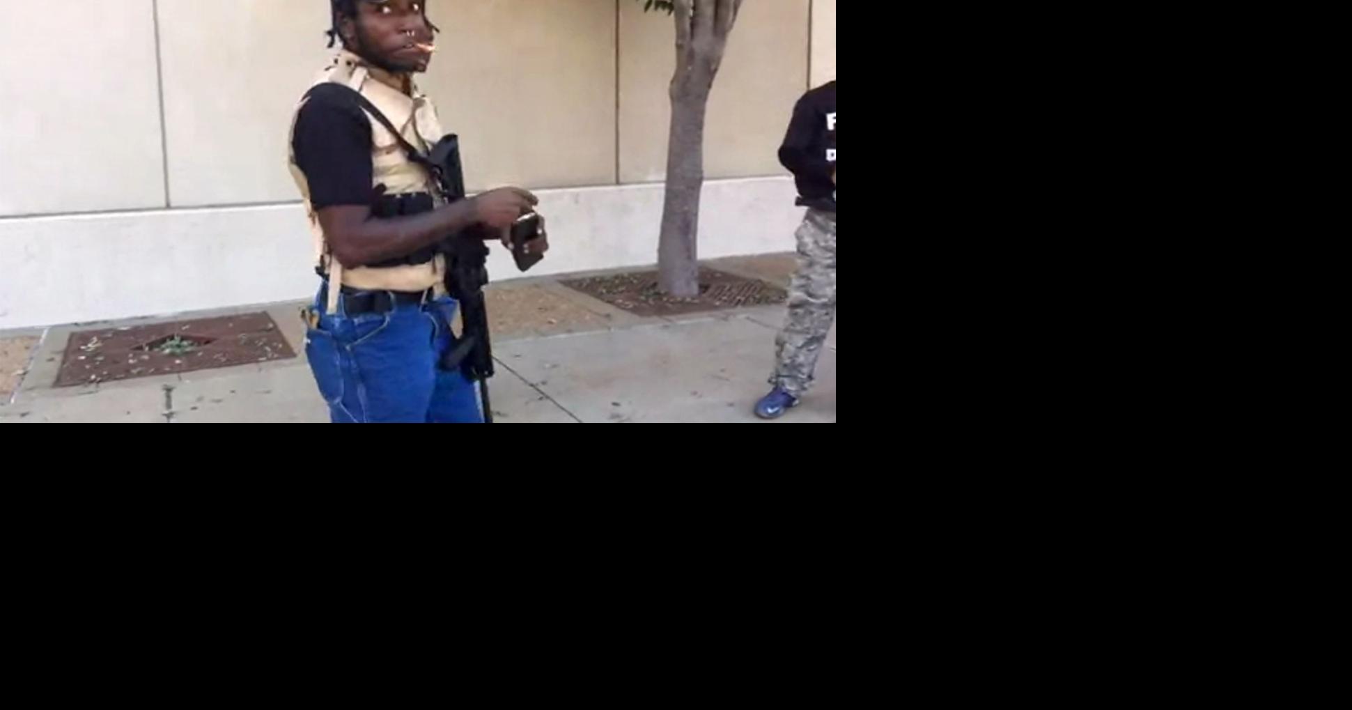 Protester armed with weapon said it is loaded and ready