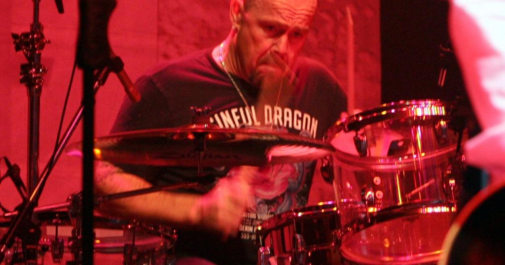 Son of Led Zeppelin drummer plays alongside dad's image