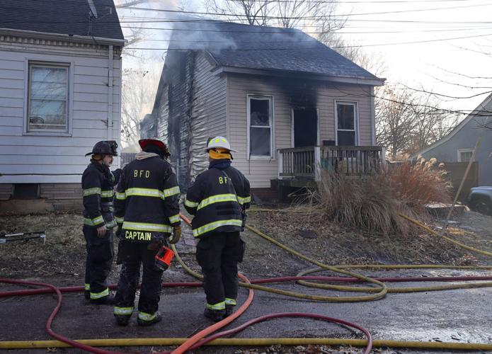 Firefighters rescue boy from house fire that killed woman in Belleville