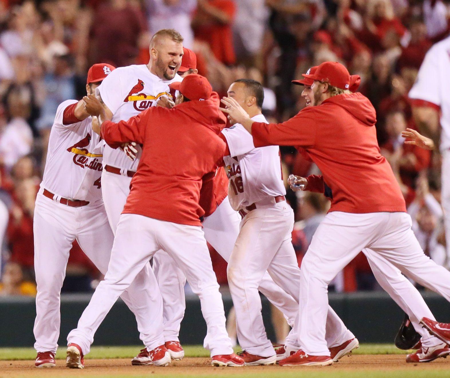 Cards win on Adams' single in 10th