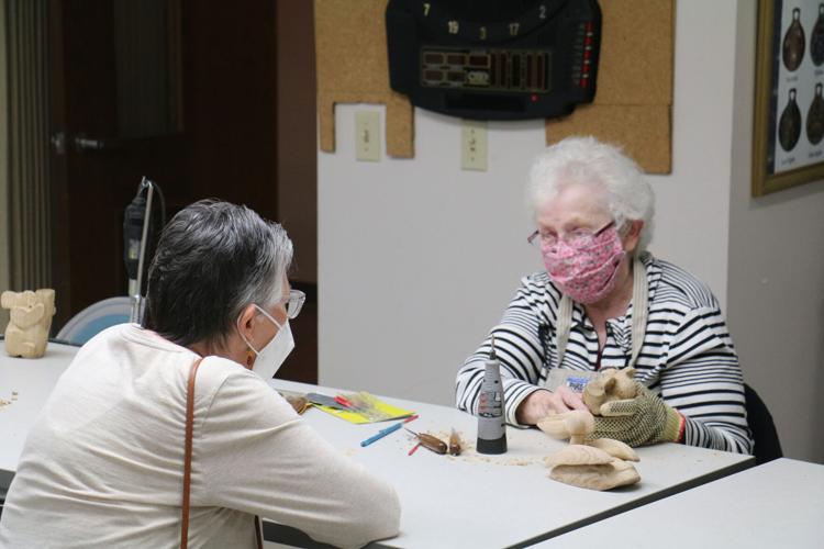 Carving out social time: Senior Center woodworking class members enjoy ...