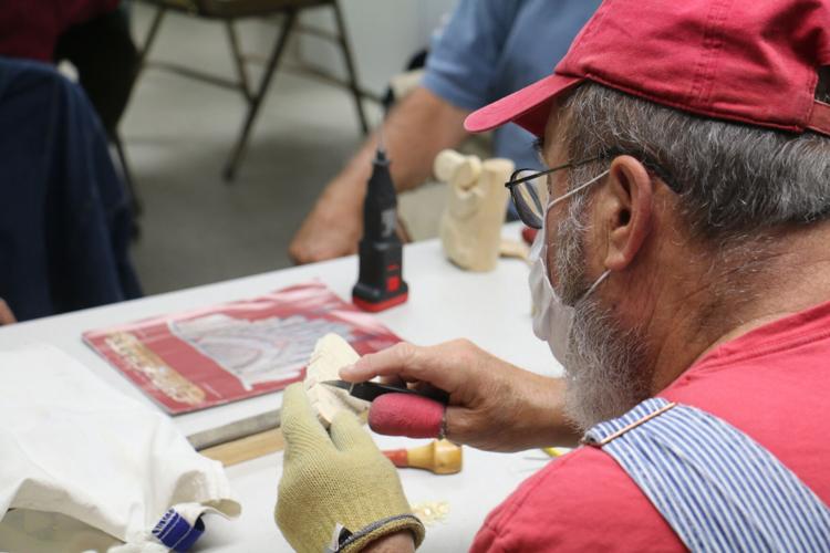 Carving out social time: Senior Center woodworking class members enjoy ...