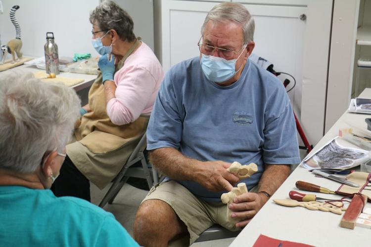Carving out social time: Senior Center woodworking class members enjoy ...