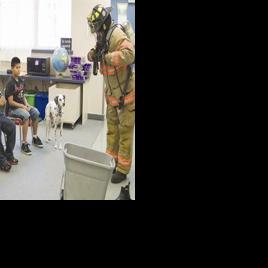 Firefighter Tony Castillo and Dottie Sue give fourth graders fire ...