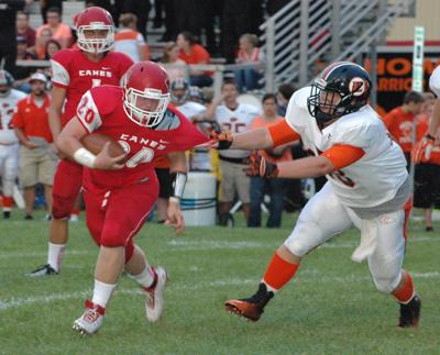 Wagner honors late dad with 3 TDs as Hurricanes win