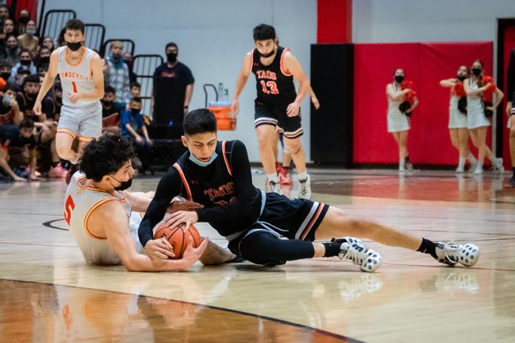 Taos boys basketball team wins conference matchup against Española ...