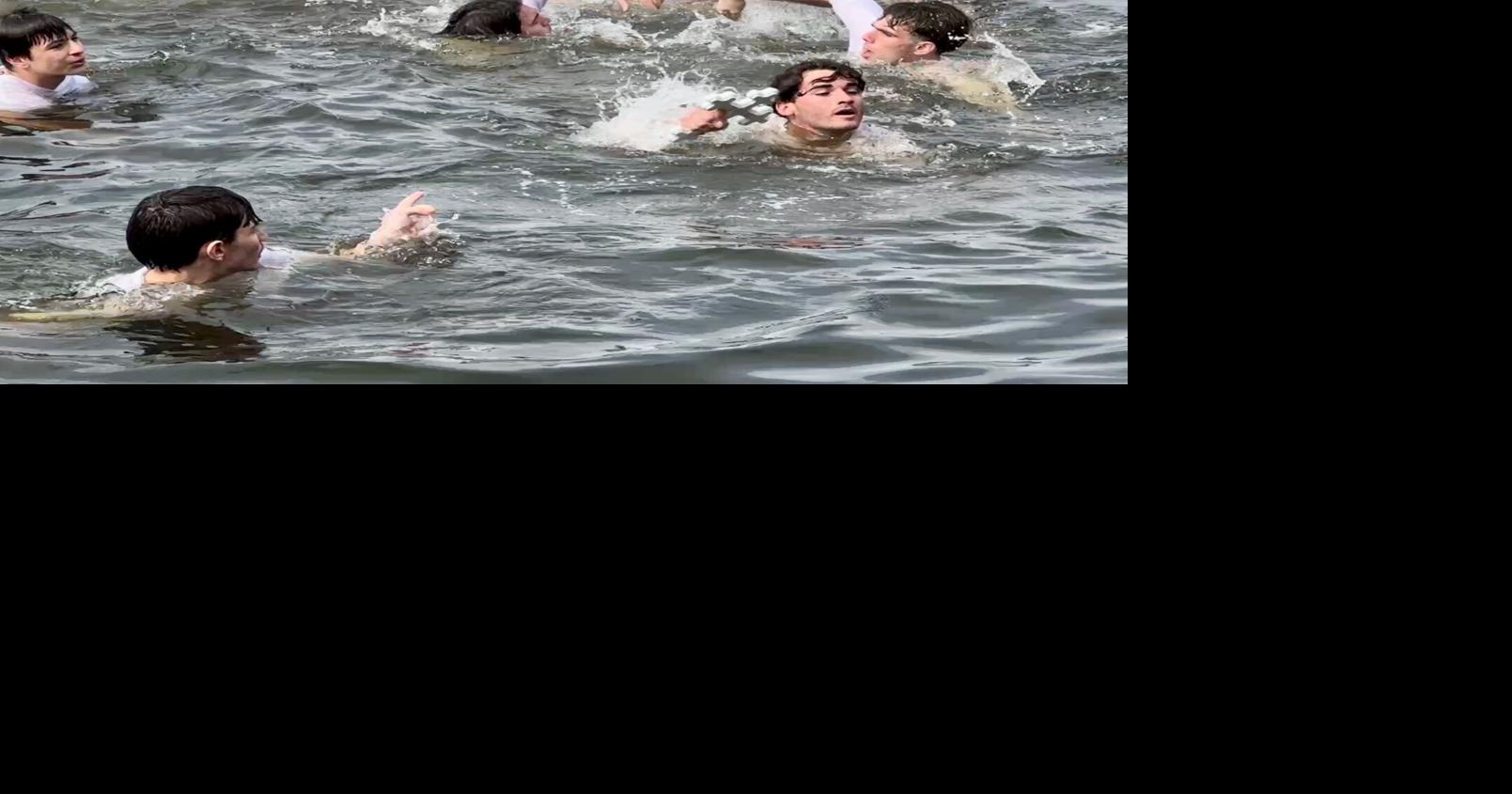 Luc Boillot, 17, emerges with cross during Ephiphany celebration ...