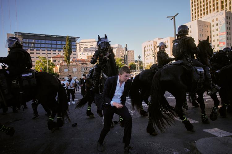 Ultra-Orthodox protesters block roads and trains across Israel over ...