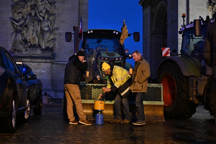 Farmers drive tractors through Paris and block highways in Greece to ...